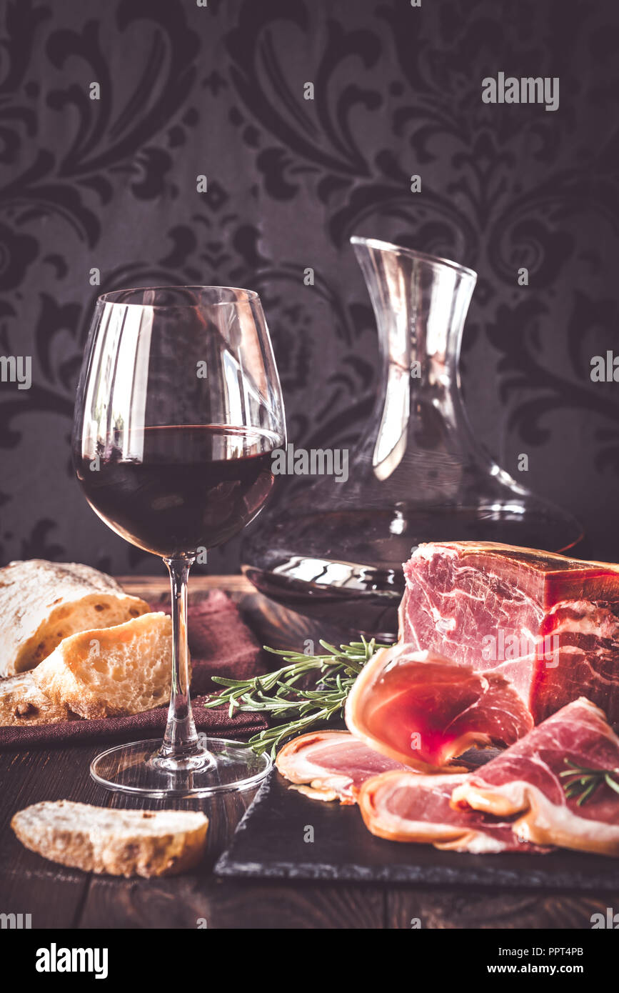 Red wine with prosciutto ham Stock Photo - Alamy