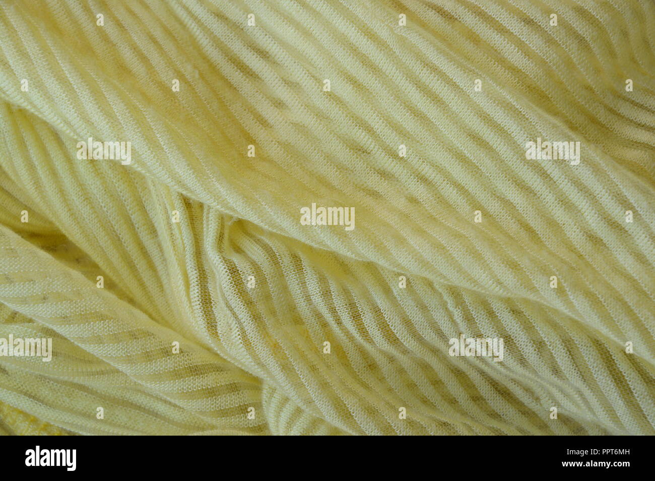 yellow slip cloth texture and background Stock Photo - Alamy