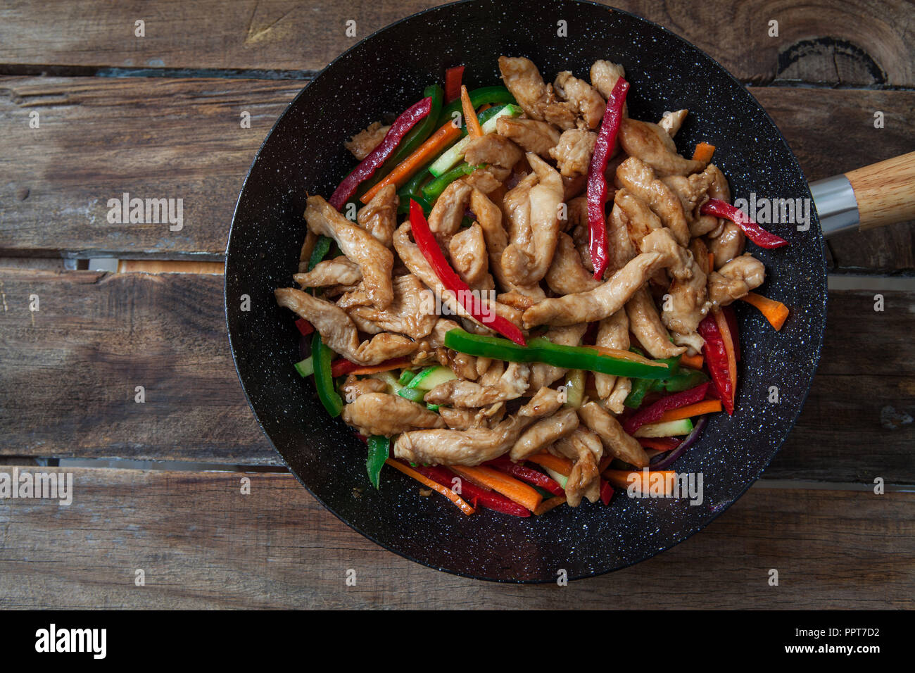 chicken and vegetables on wok with soya sauce Stock Photo - Alamy