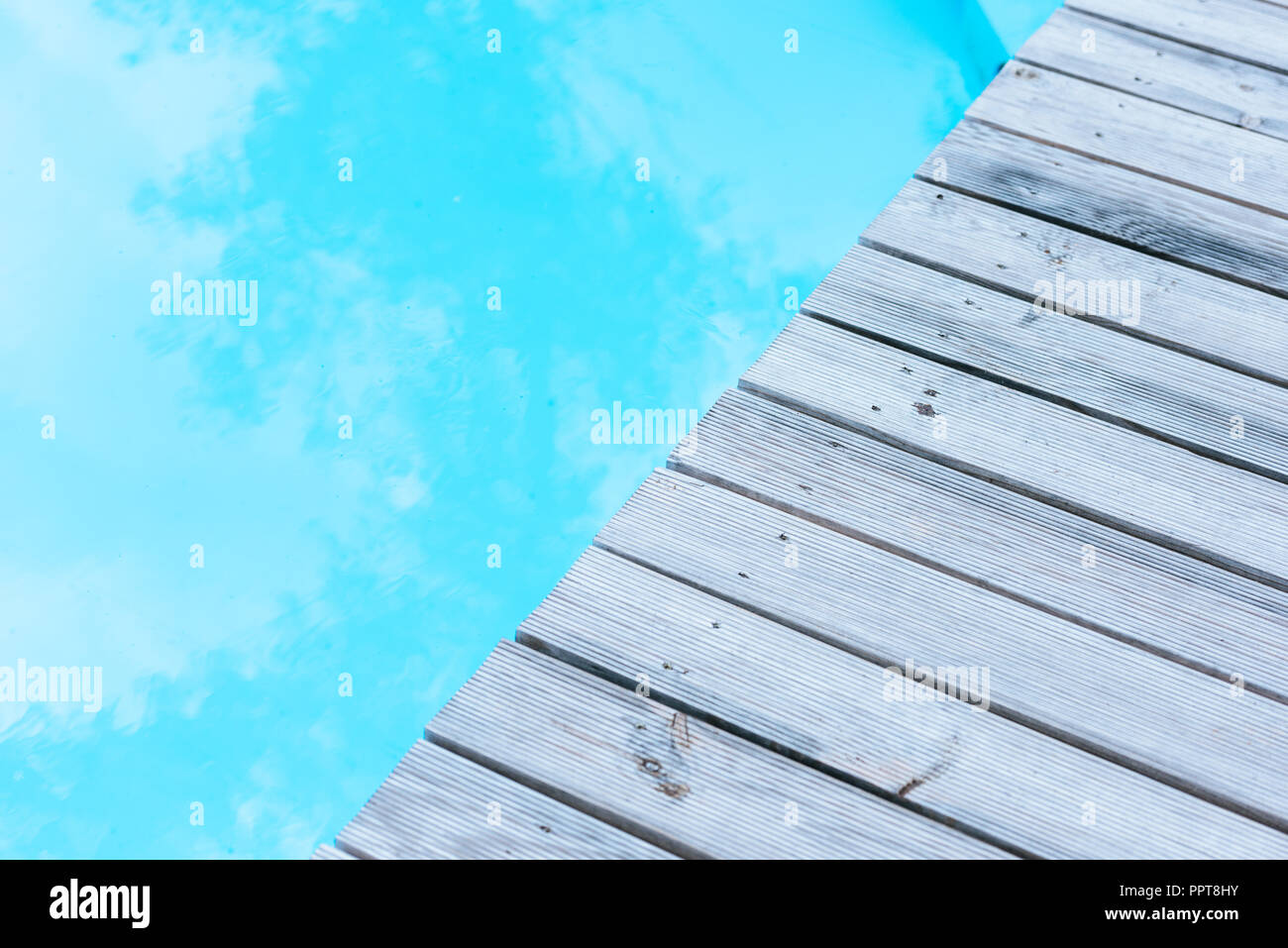 grey wooden planks and clear transparent swimming pool Stock Photo - Alamy