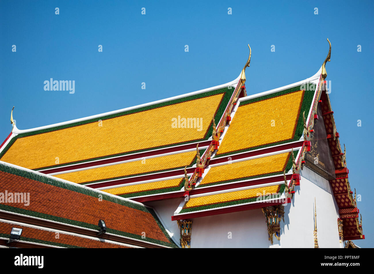 Roof finials and coloured tiles, traditional architectural details, on ...