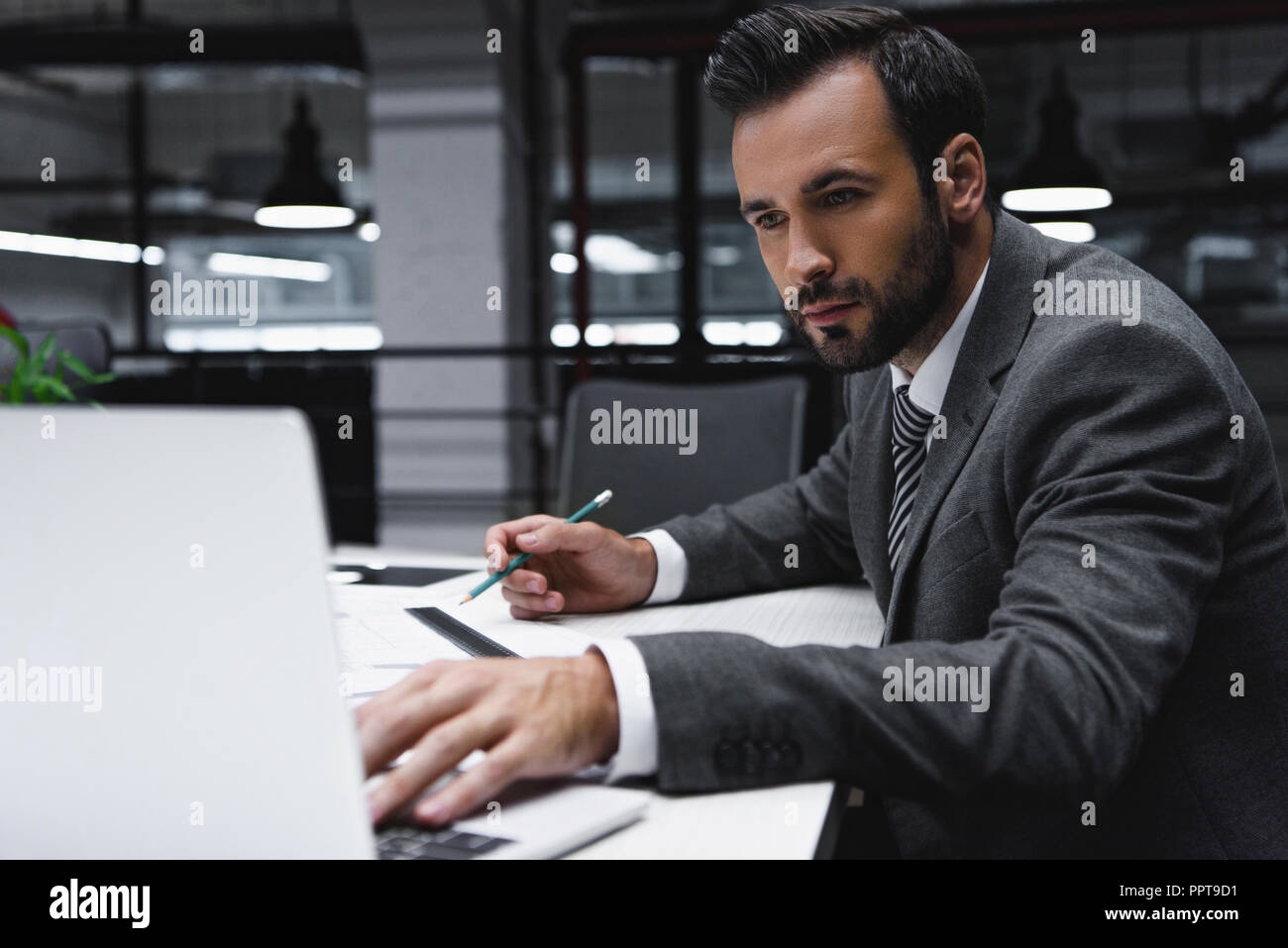 Engineer working blueprints laptop hi-res stock photography and images ...