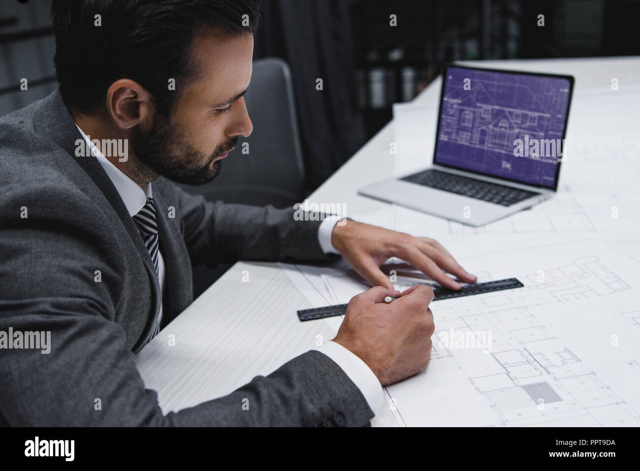 Male engineer working blueprints hi-res stock photography and images ...