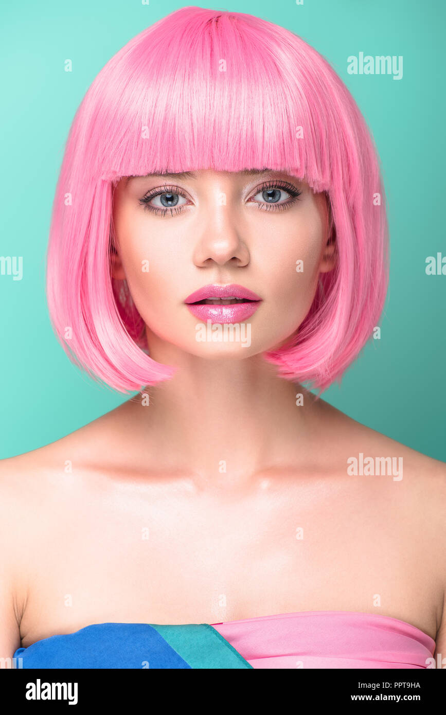 close-up portrait of young woman with pink bob cut and stylish makeup ...