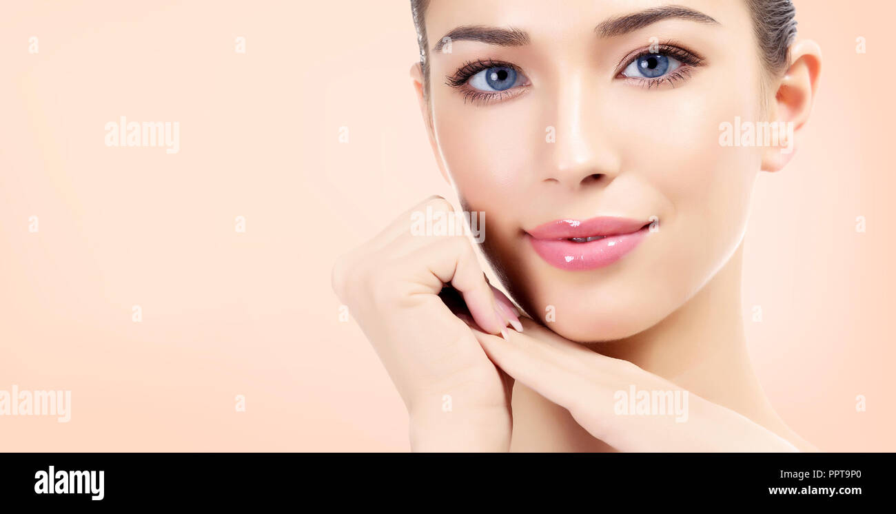 Pretty woman with clean and fresh skin is smiling to you. Beautiful ...