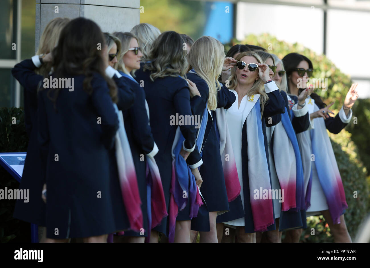 Kate Rose adjusts her sunglasses as the Team Europe wives and ...