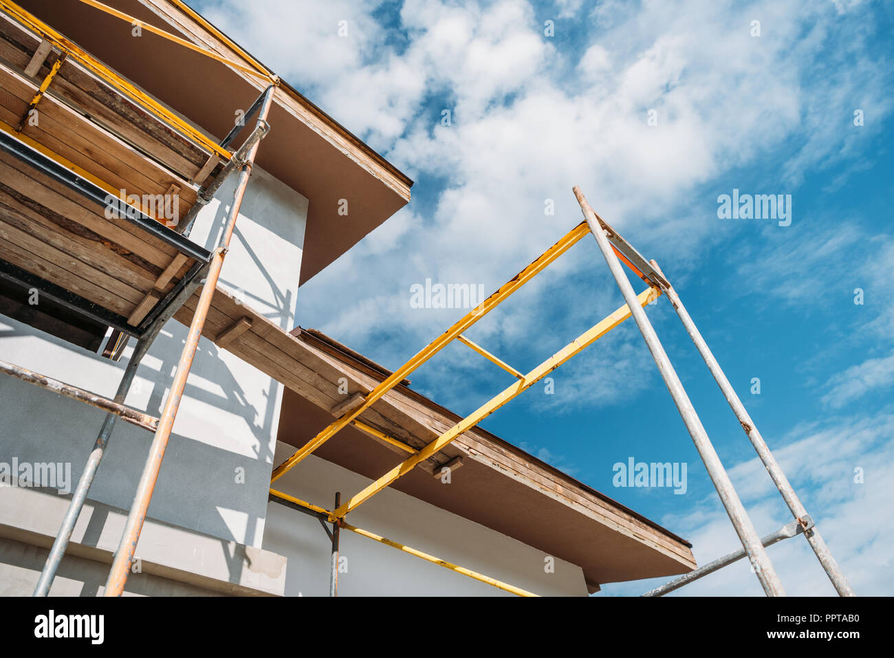 bottom view of scaffolding of construction site of modern building ...