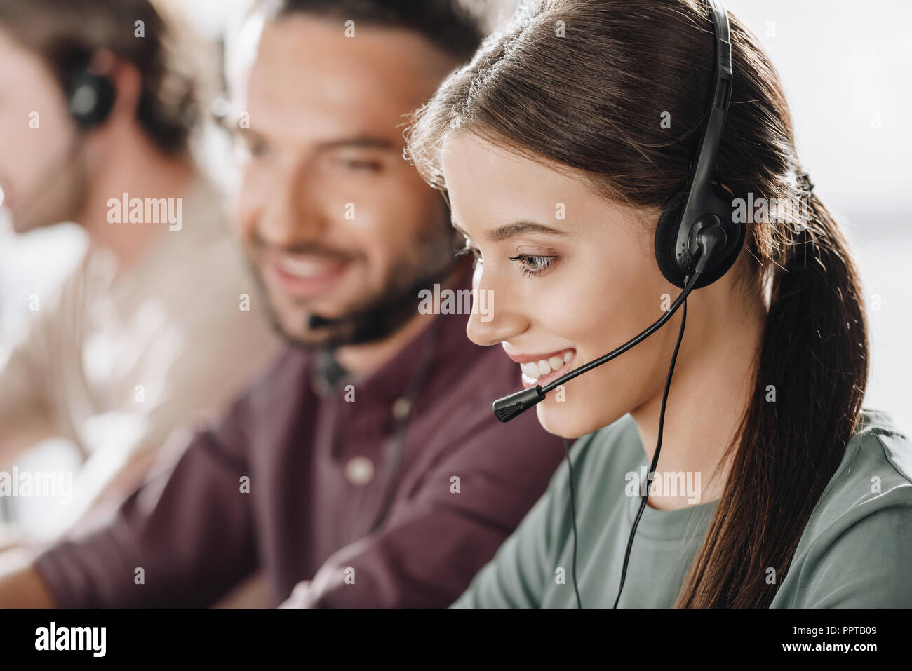 happy team of call center managers working together at modern office ...