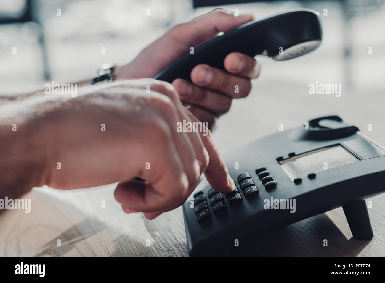 cropped shot of man making dialing stationary phone to make call Stock ...