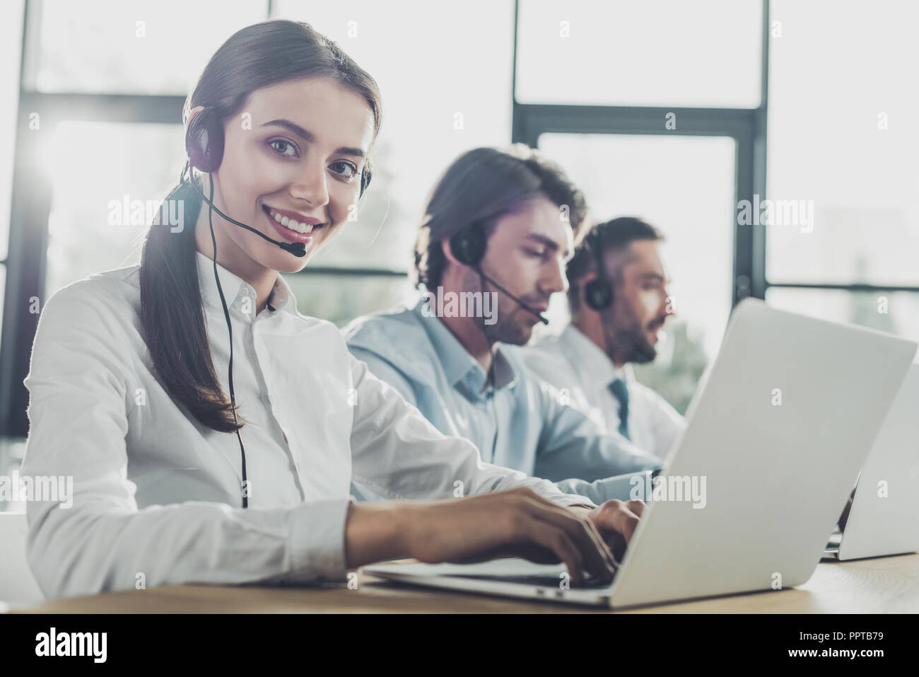 Happy call center workers hi-res stock photography and images - Alamy