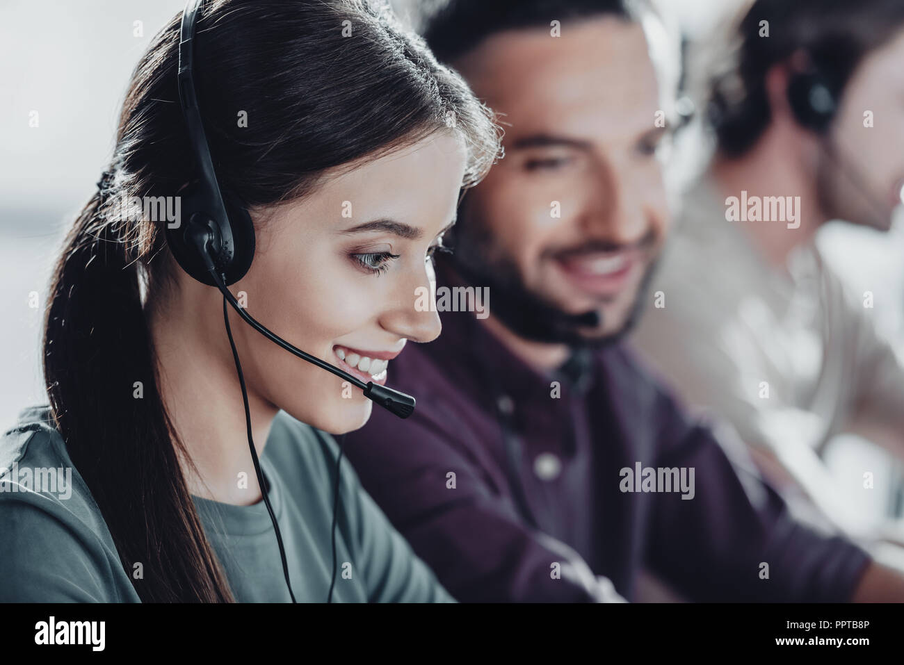 Happy call center workers hi-res stock photography and images - Alamy