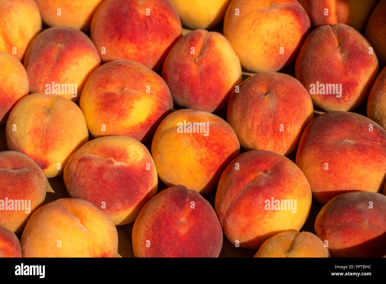 beautiful big red peaches in a drawer Stock Photo - Alamy