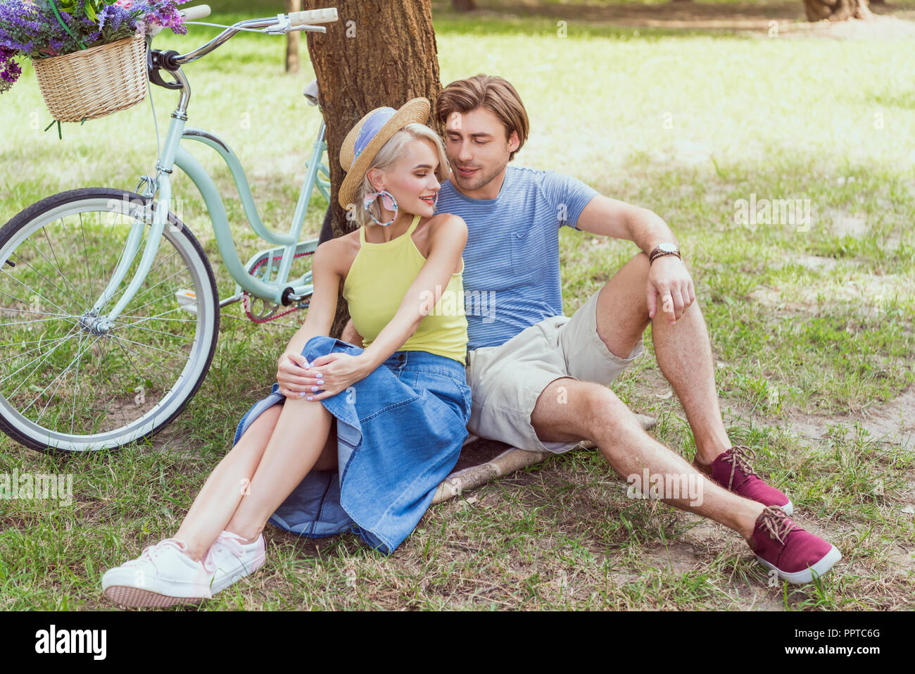 Sitting near tree hi-res stock photography and images - Alamy