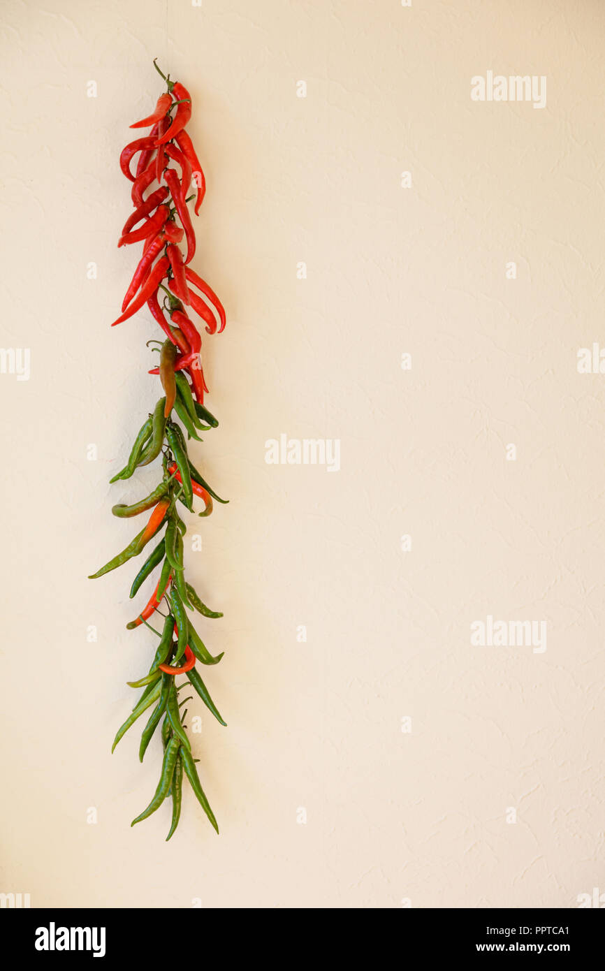 Hot red chili or chilli pepper ristra Stock Photo - Alamy