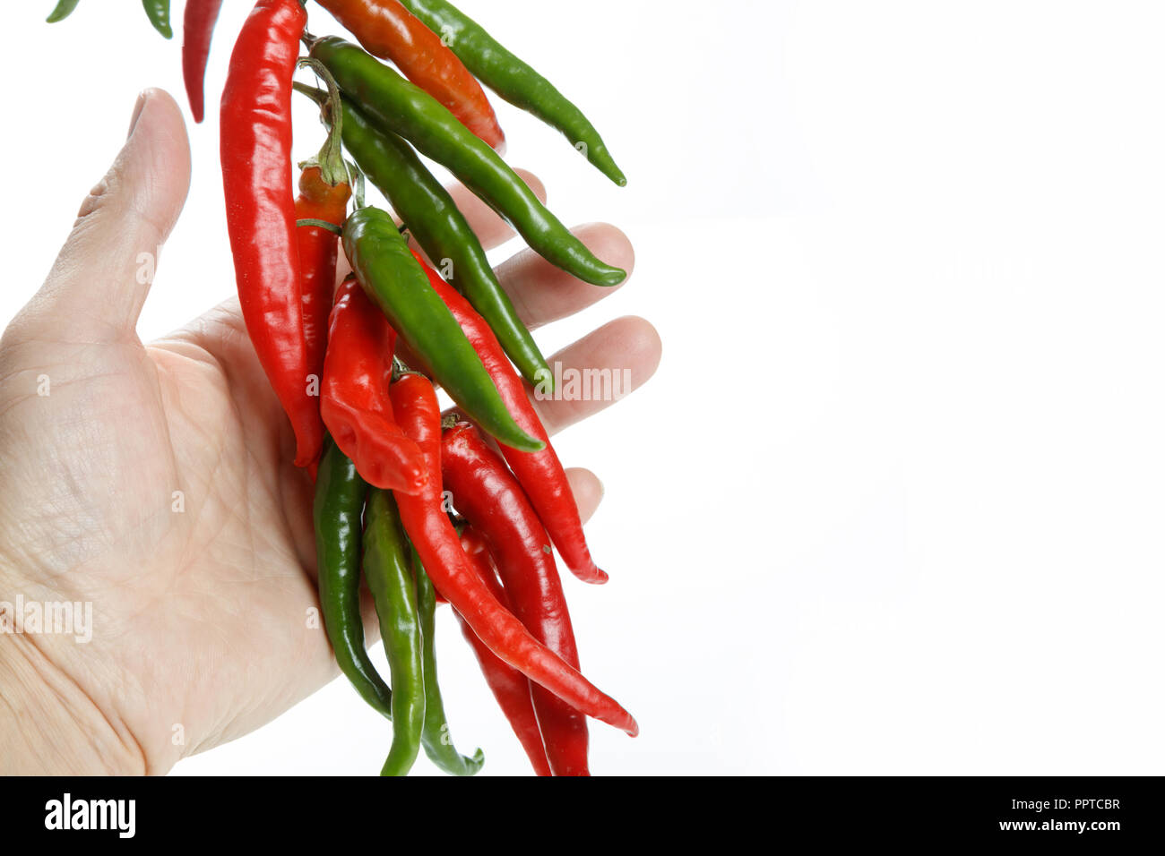 Hot red chili or chilli pepper ristra Stock Photo - Alamy