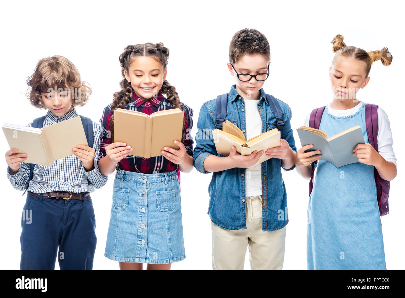 schoolchildren standing and reading books isolated on white Stock Photo ...