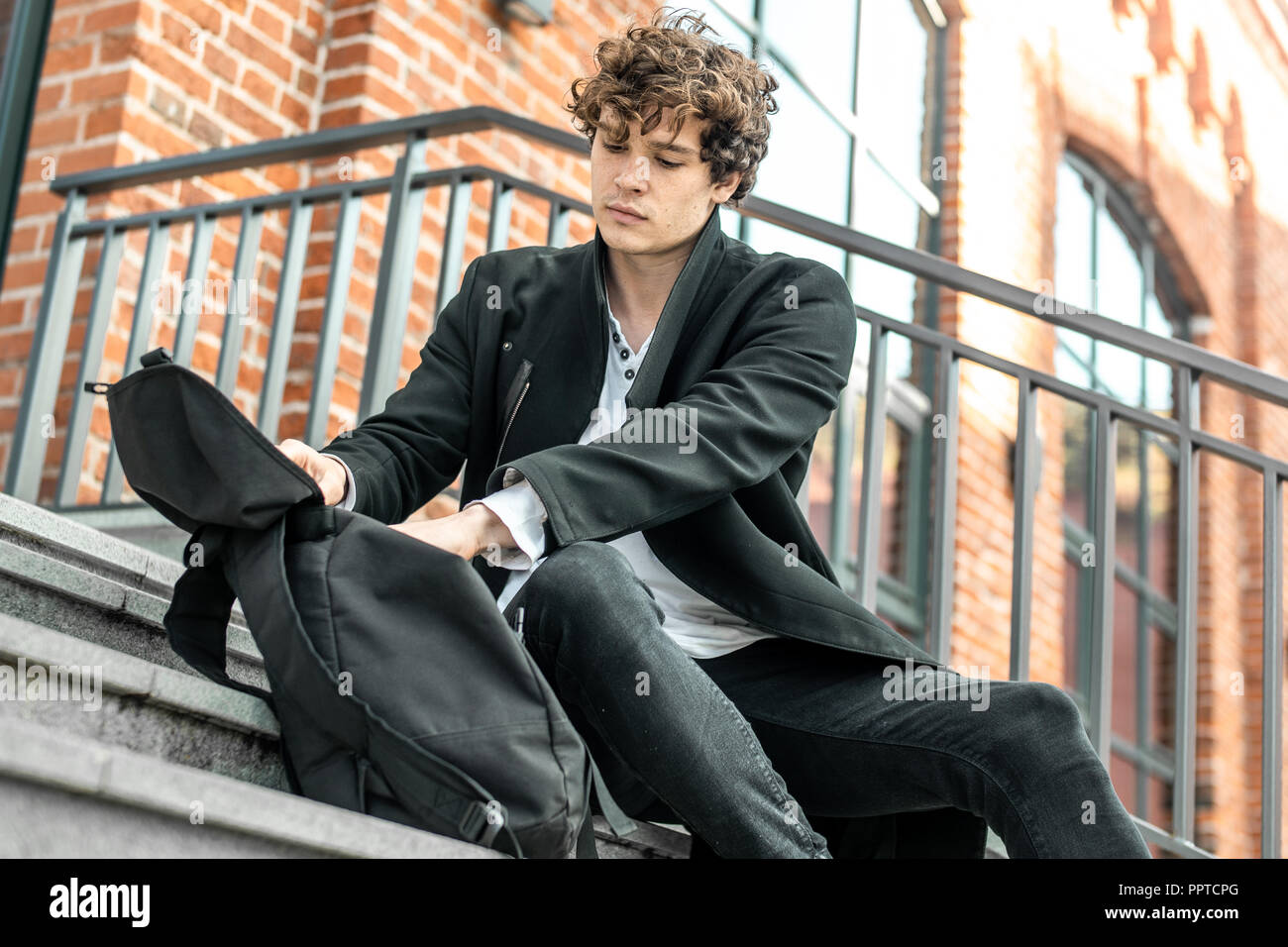 Rummaging in bag hi-res stock photography and images - Alamy