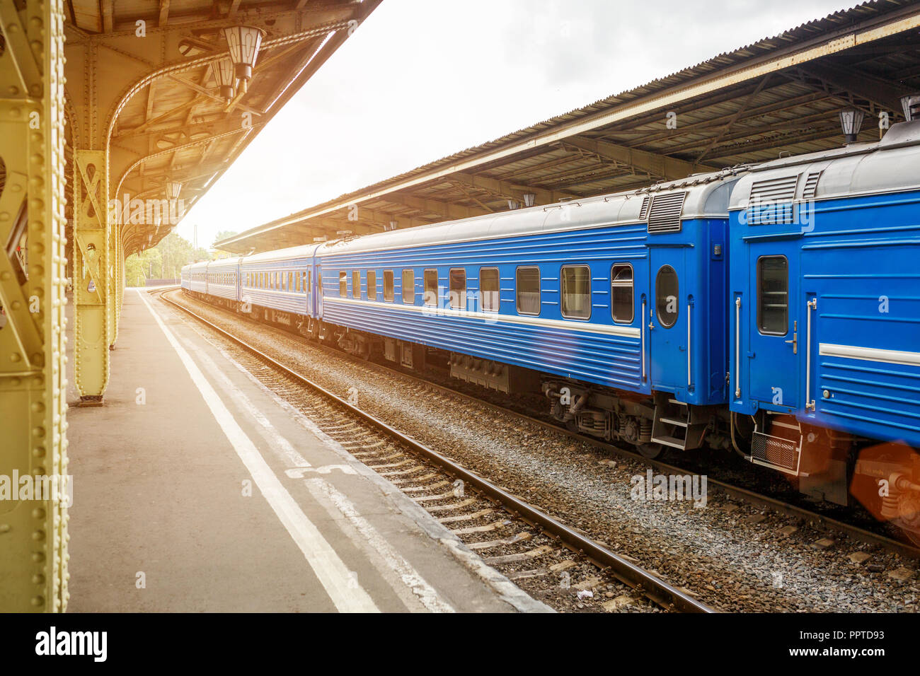 the train is on the platform at the station Stock Photo - Alamy