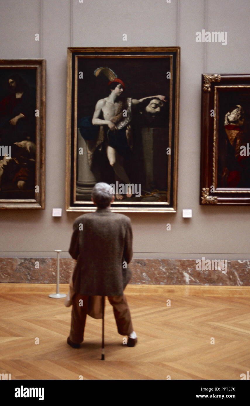 Art aficionado sitting on a monopod chair,Louvre Museum,Paris Stock ...