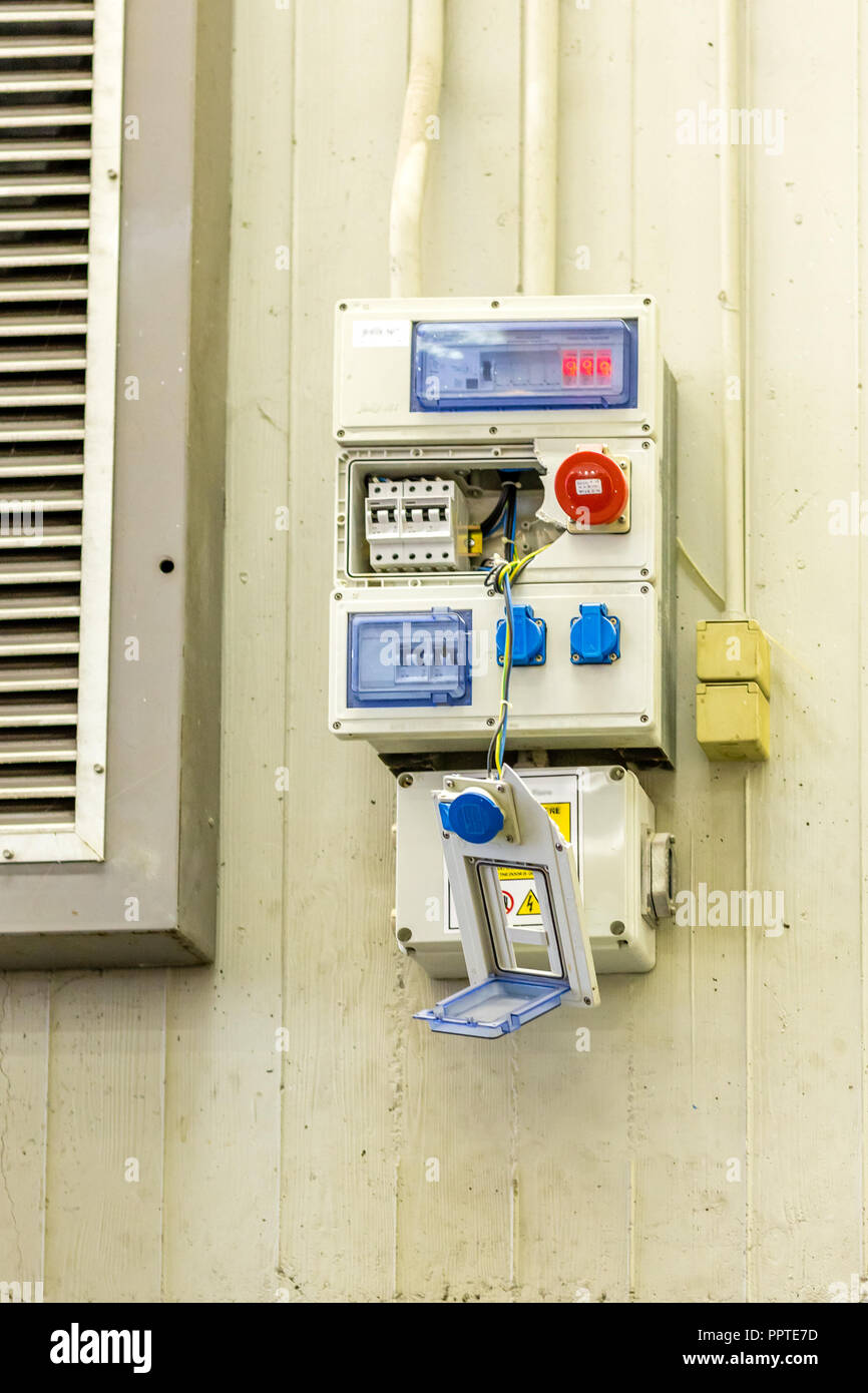 Broken electrical Panel with hanging cover Stock Photo - Alamy
