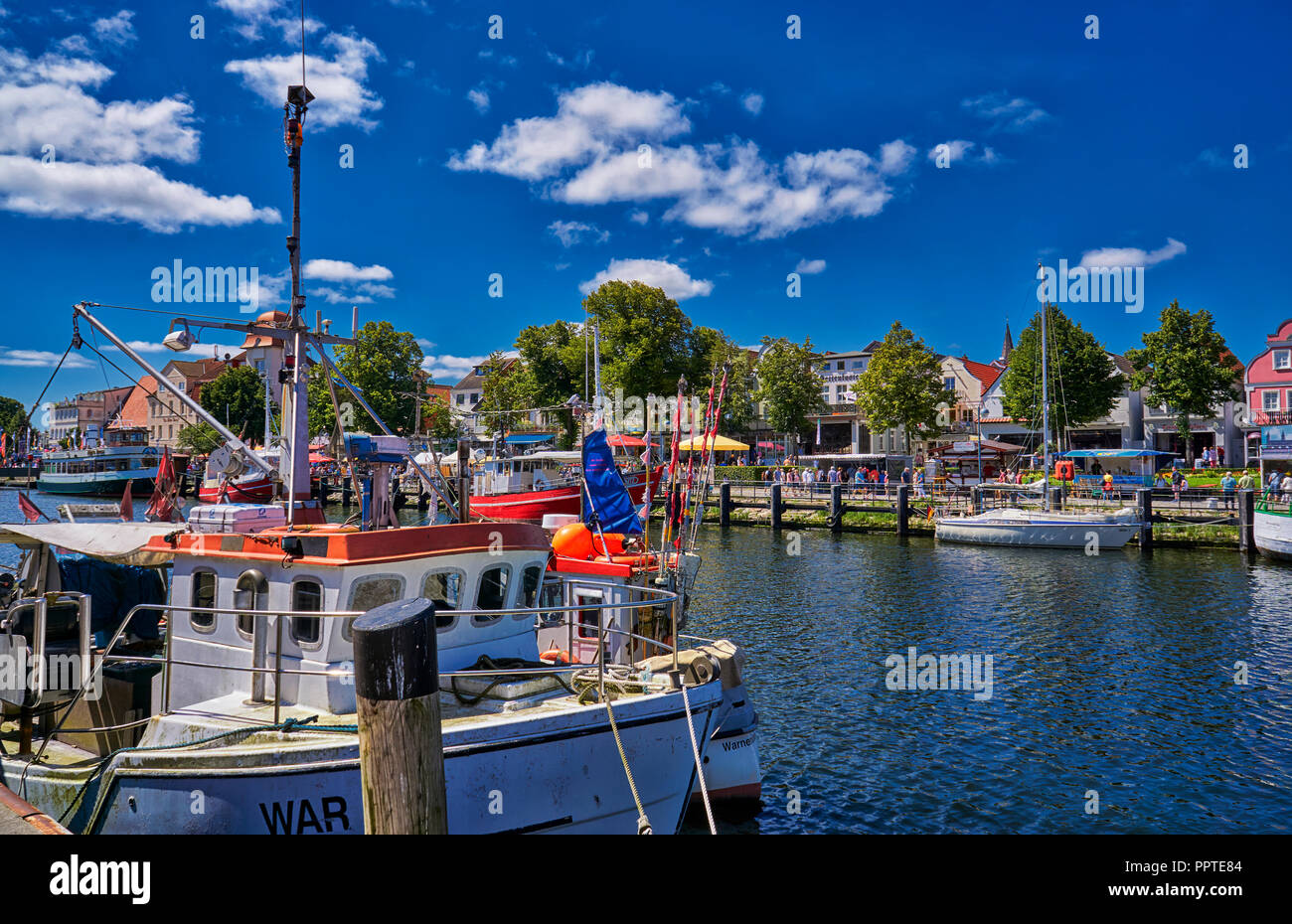Rostock, Germany - Colorful Fishing boats resting in the peaceful canal ...