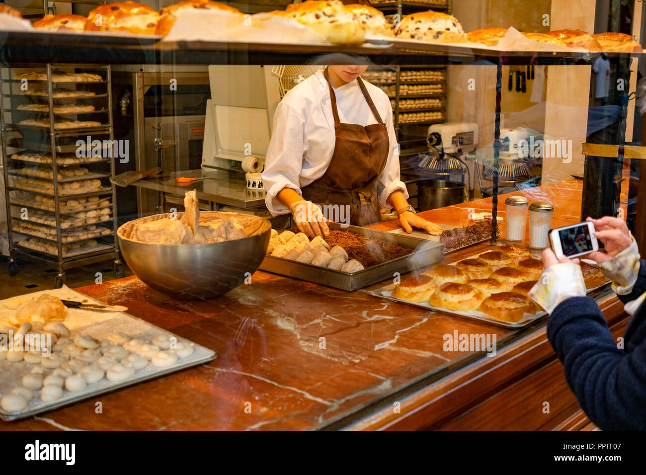 Baker Working in Bakery Stock Photo - Alamy