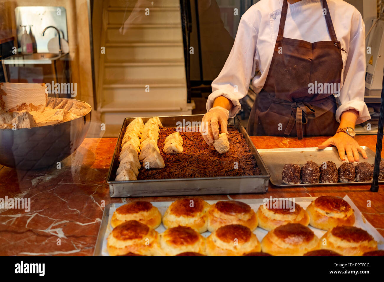 Baker Working in Bakery Stock Photo - Alamy