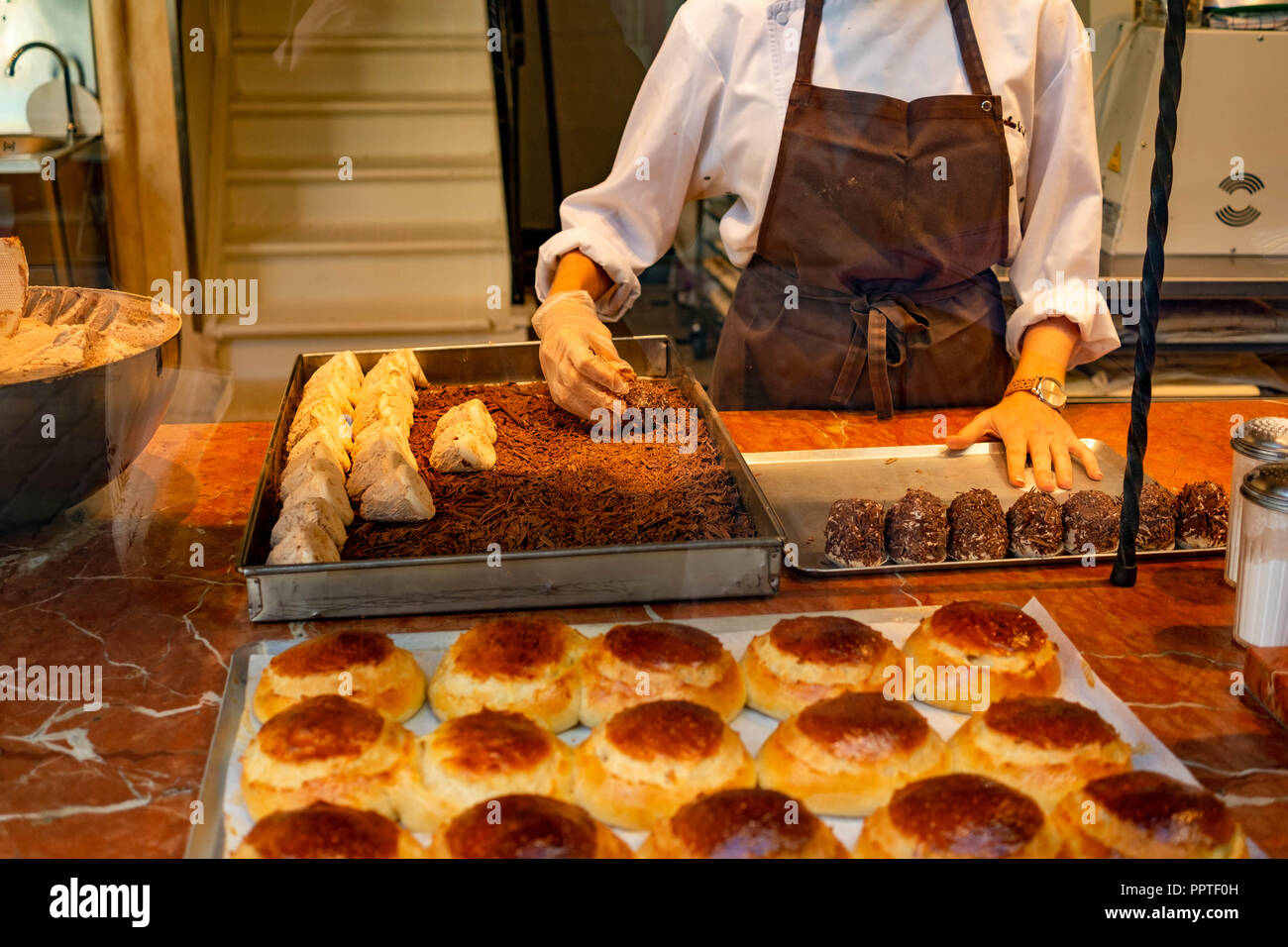 Baker Working in Bakery Stock Photo - Alamy