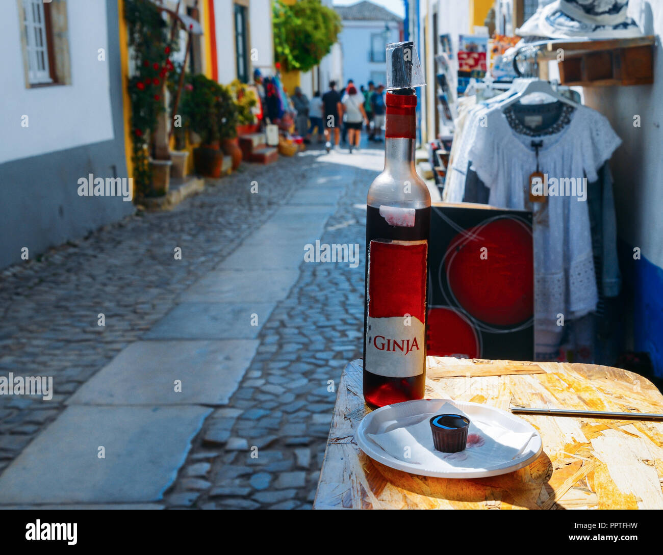 Ginja de Obidos, traditional sour cherry liquor, served in small cups ...