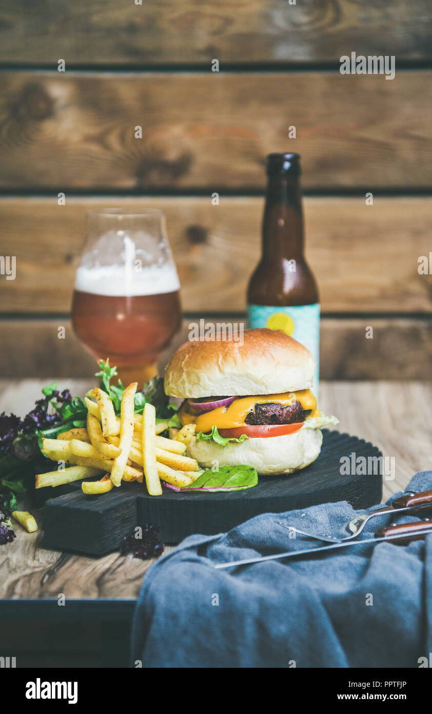 Classic burger dinner with beer and french fries Stock Photo - Alamy