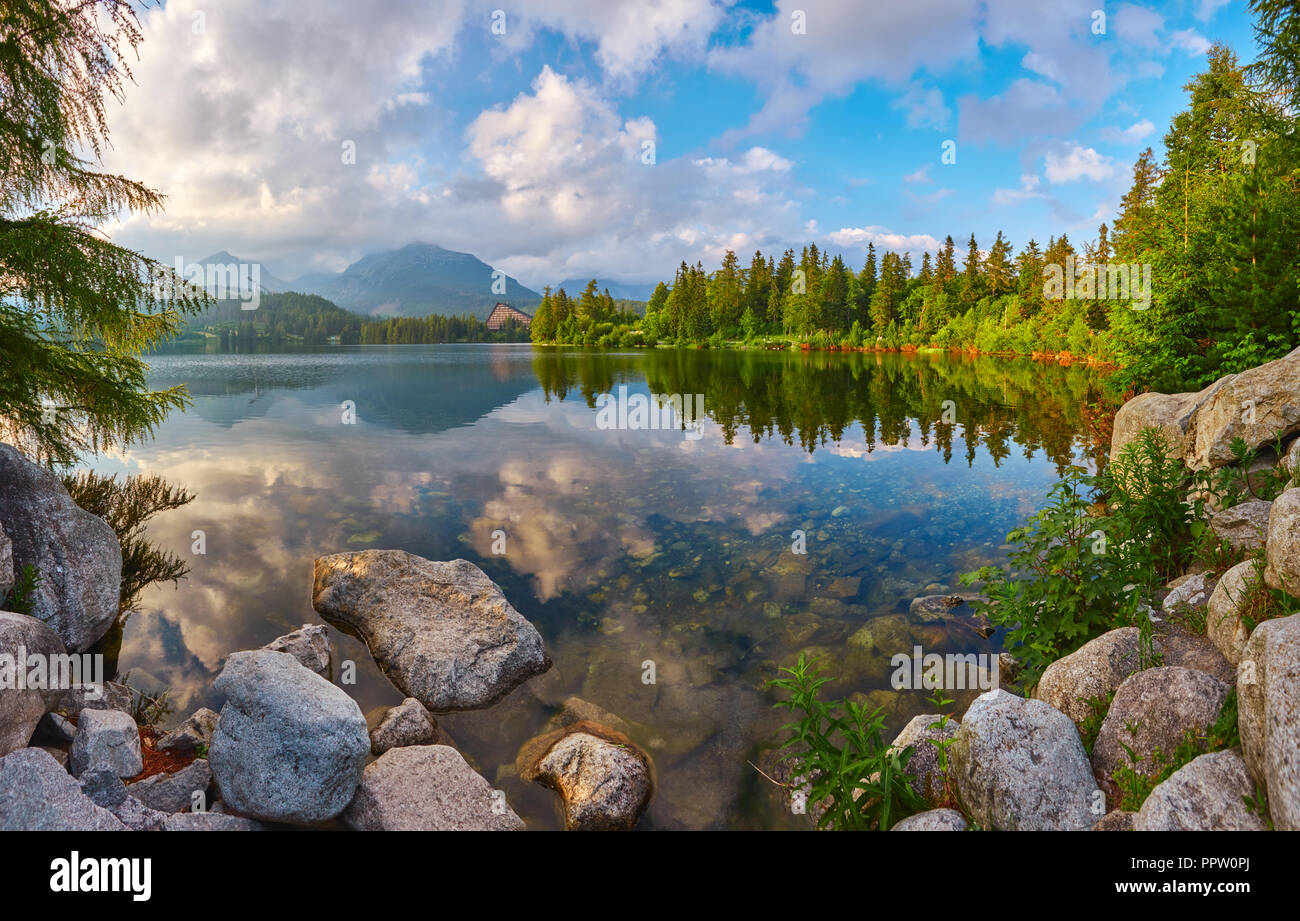 Lake in the High Tatras in the rays of the evening sun on a background ...