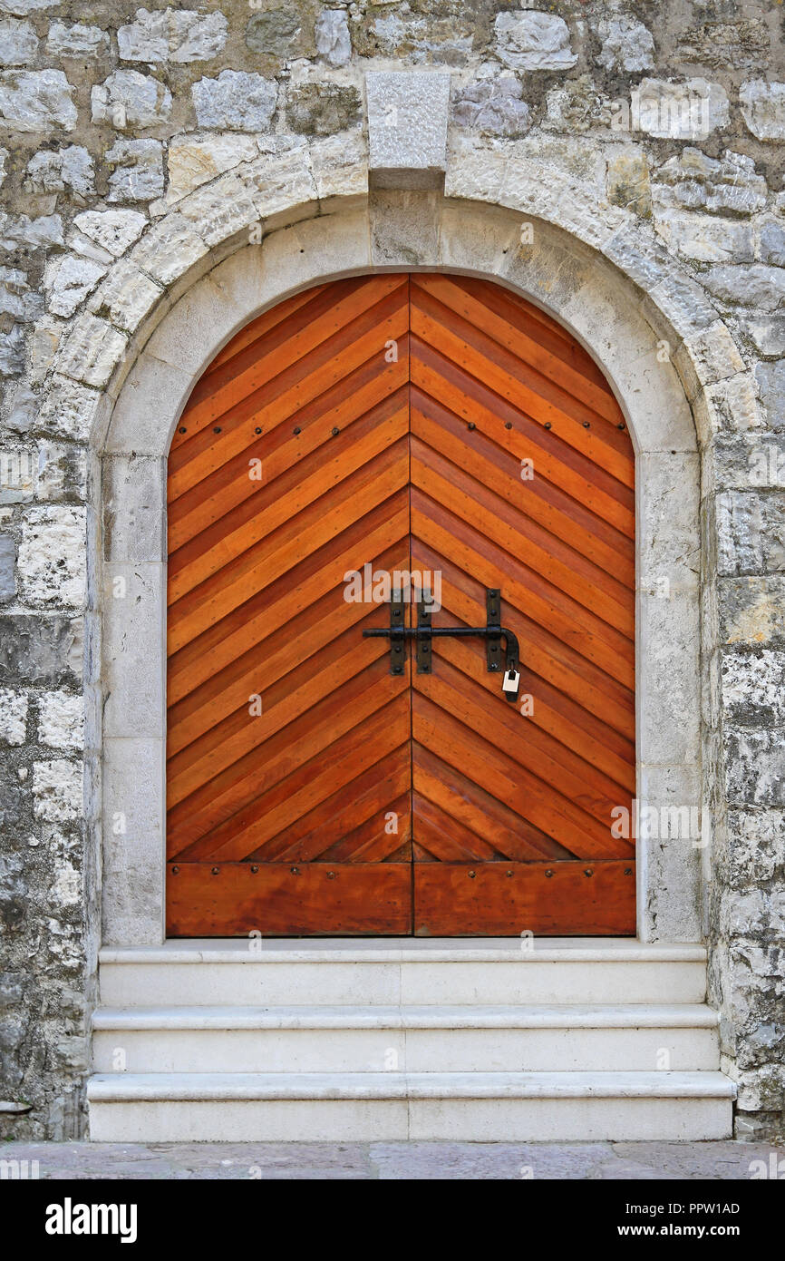 Wooden arch doors at medieval castle in Budva Stock Photo - Alamy