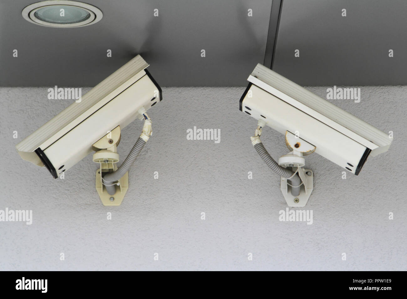 Two old CCTV security cameras at wall Stock Photo - Alamy