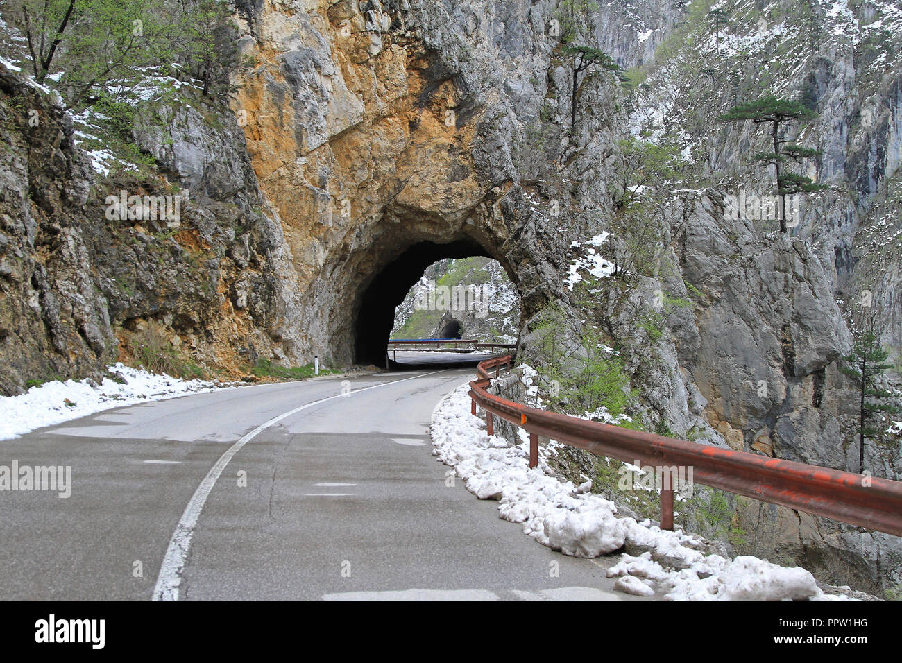 Mountain road with many tunnels in Montenegro Stock Photo - Alamy