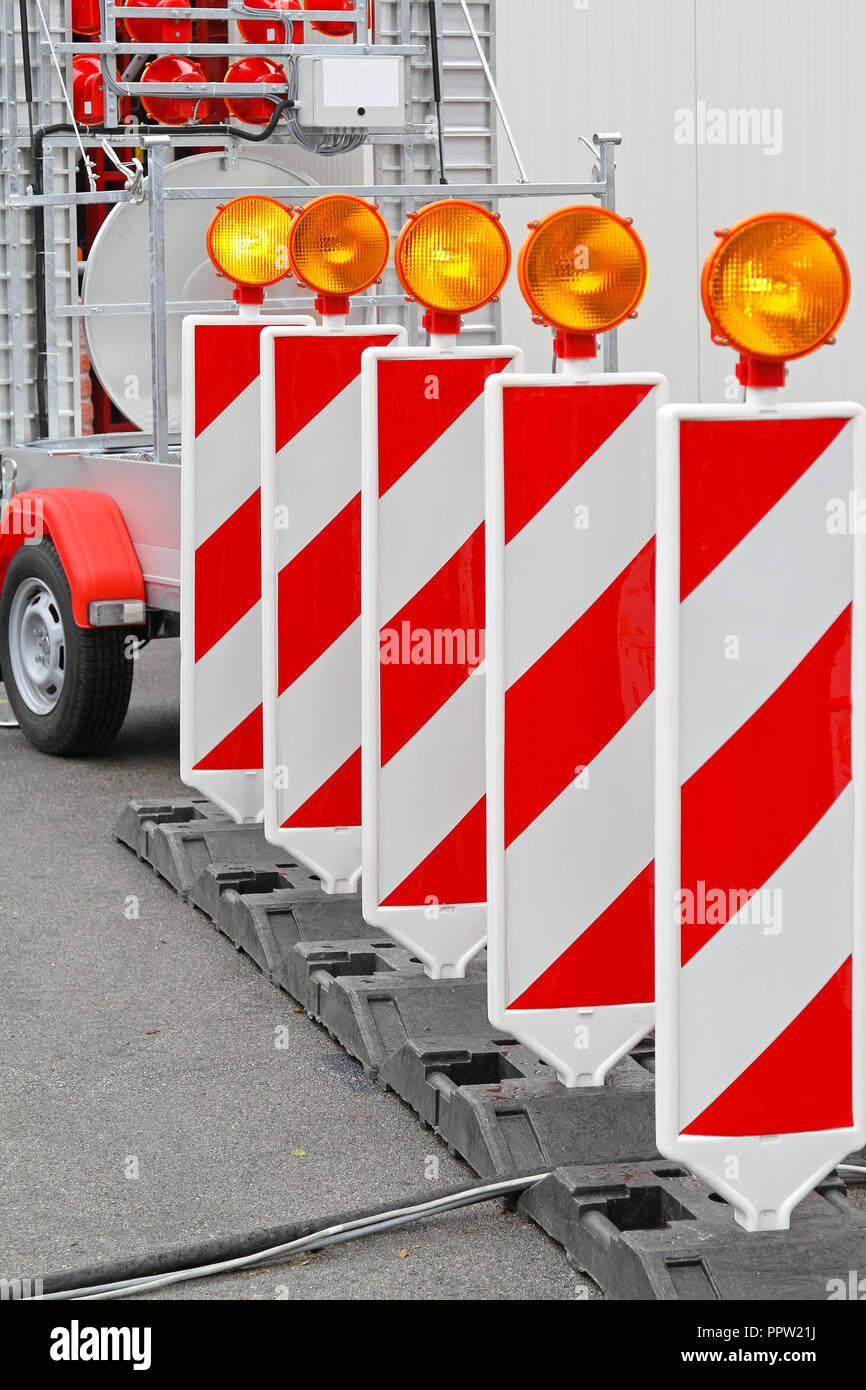 Road barrier with amber beacon flashing lights Stock Photo - Alamy