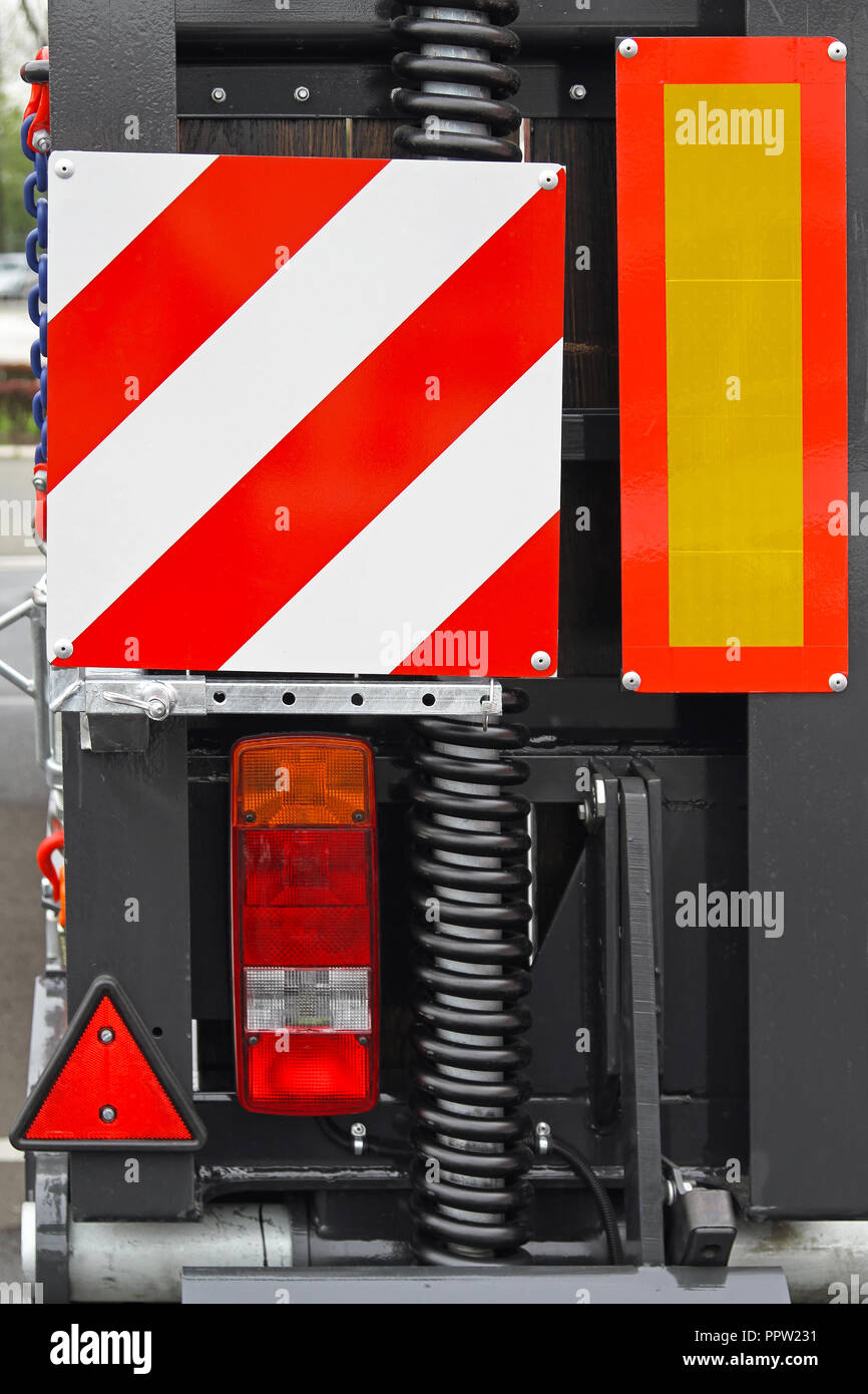 Trailer lights and retroreflective warning traffic signs Stock Photo ...