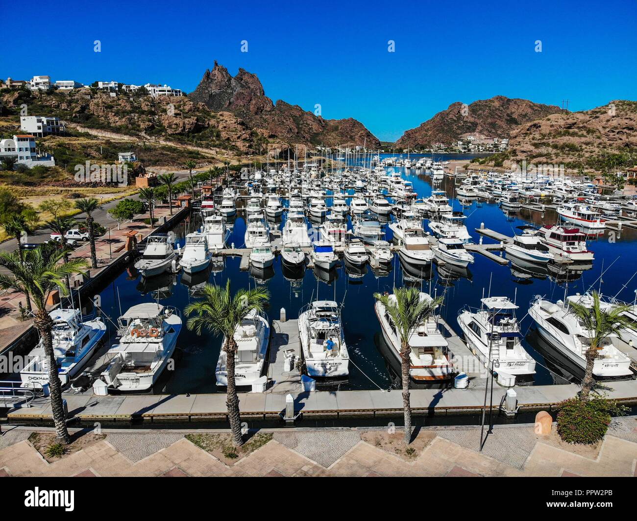 Aerial view of yacht pier, boats, palms, Tetakahui bay near the desert ...