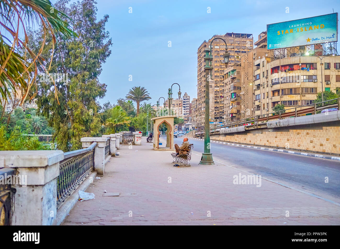 CAIRO, EGYPT - DECEMBER 23, 2017: The old man rests on the bench in ...