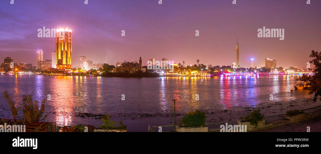 The beautiful view on the illuminated high-rise buildings on the bank ...