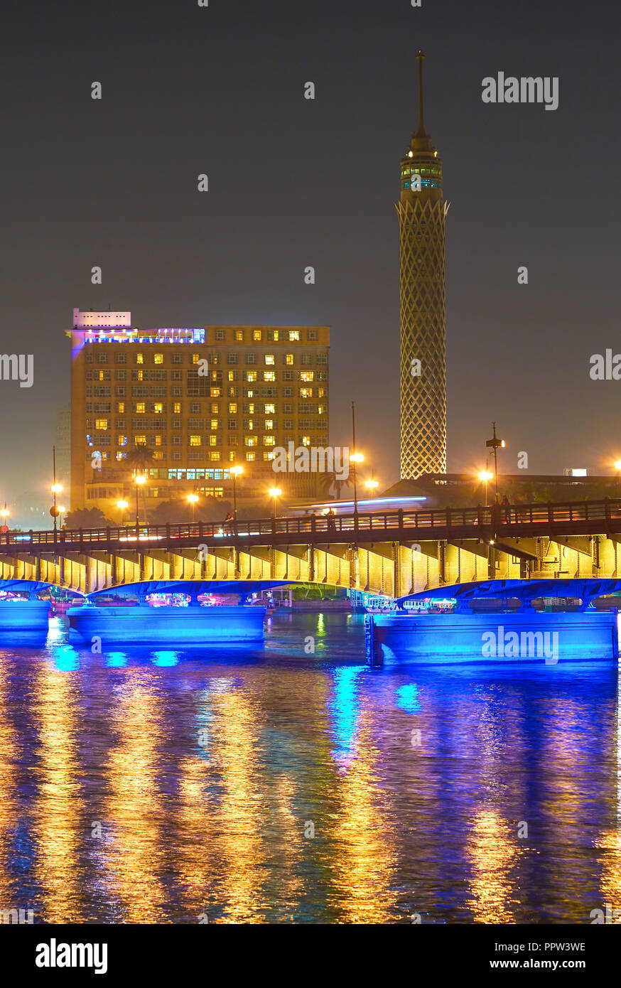 The illuminated 6th October bridge over the Nile river with modern ...