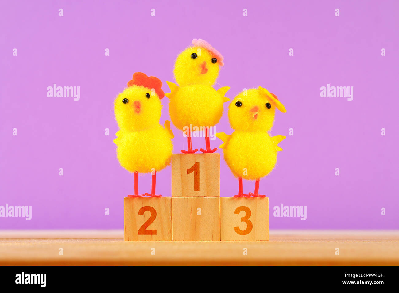 Three chicken on a pedestal. The first, second and third place Stock ...