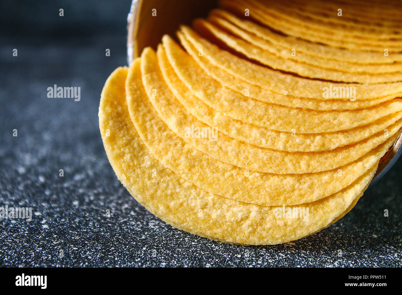 Crispy chips in a jar on a gray dark table. Snack Stock Photo - Alamy