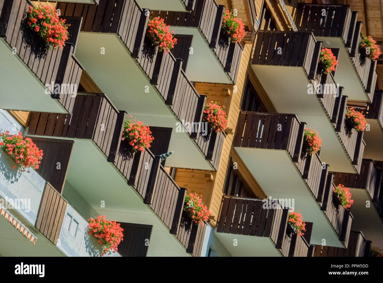 Red flowers on balcony hi-res stock photography and images - Alamy