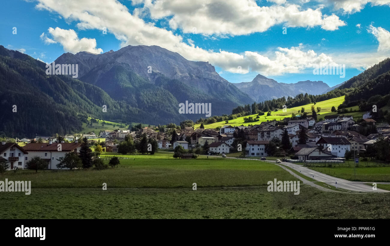 Sun is setting on Mustair in Val Mustair (Graubunden, Switzerland), an ...