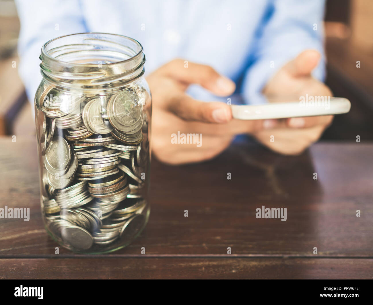 Hands donating coins in hi-res stock photography and images - Alamy