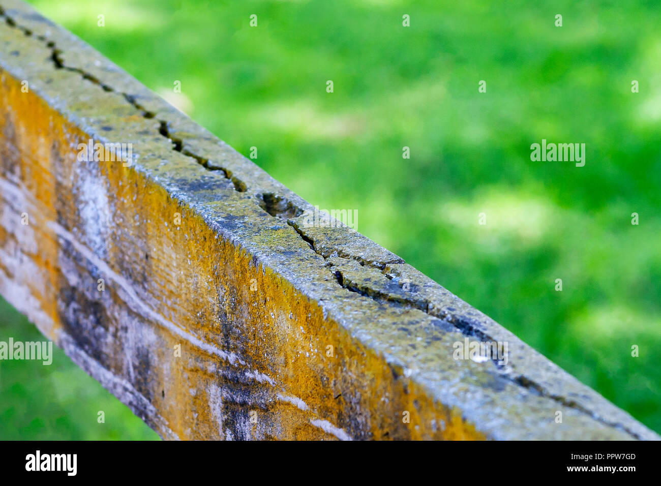 Cracked concrete fence with vibrant colors Stock Photo - Alamy