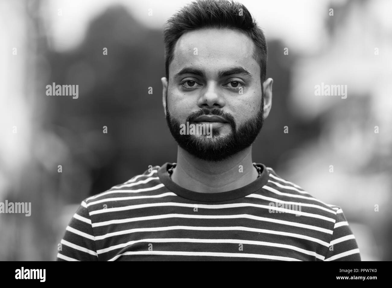 Young bearded Indian man outdoors in black and white Stock Photo - Alamy