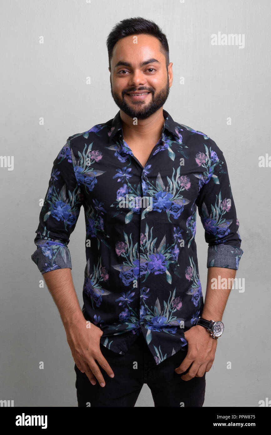 Young bearded Indian man against white background Stock Photo - Alamy