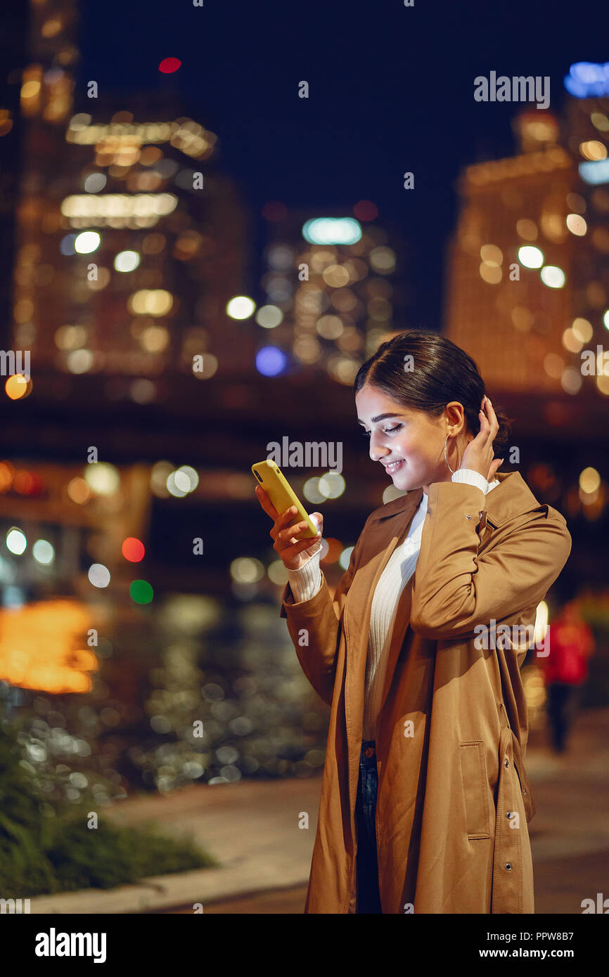 girl at night with phone Stock Photo - Alamy