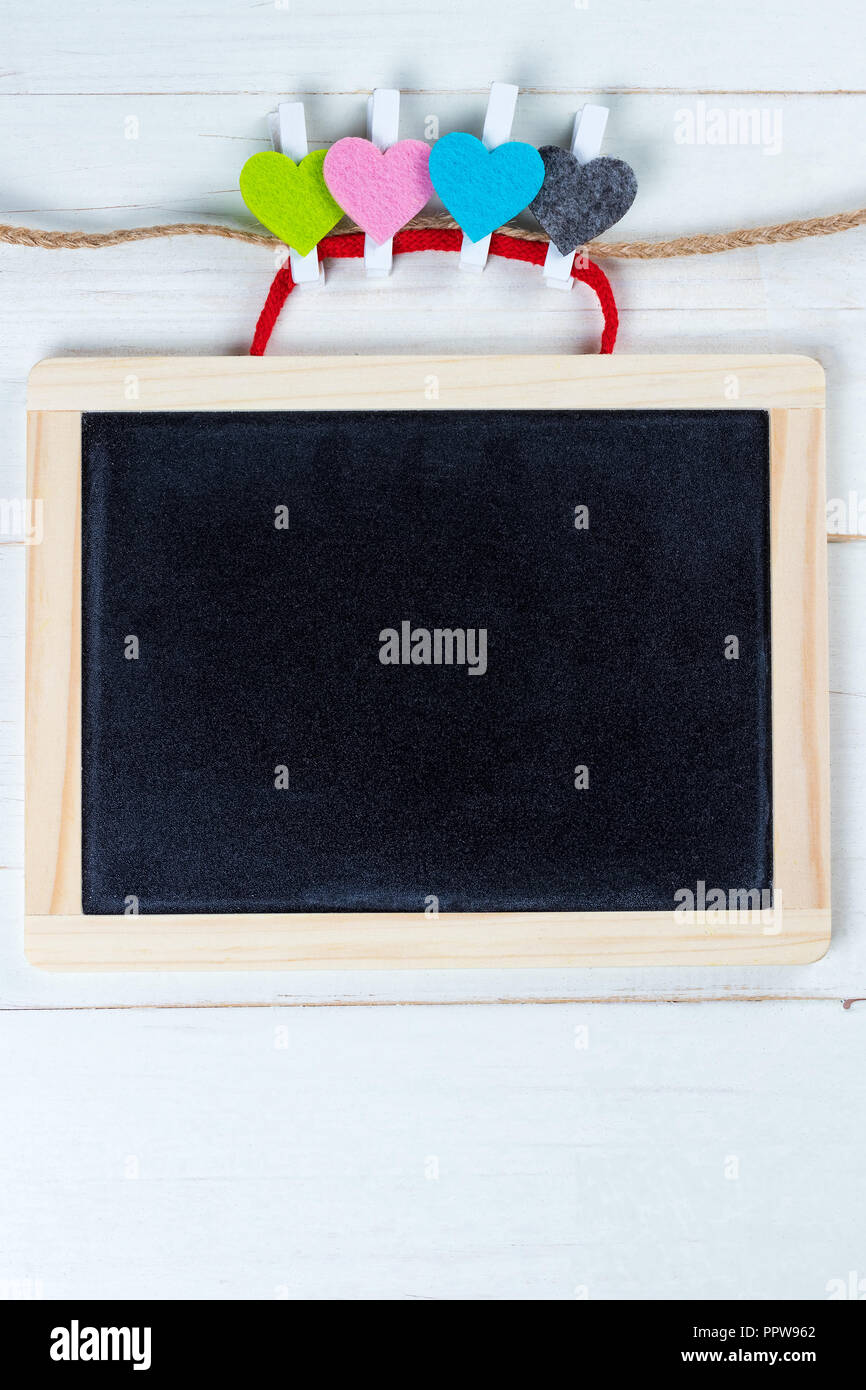 Blank blackboard with Valentines Day hearts. Twine string. Vertical ...